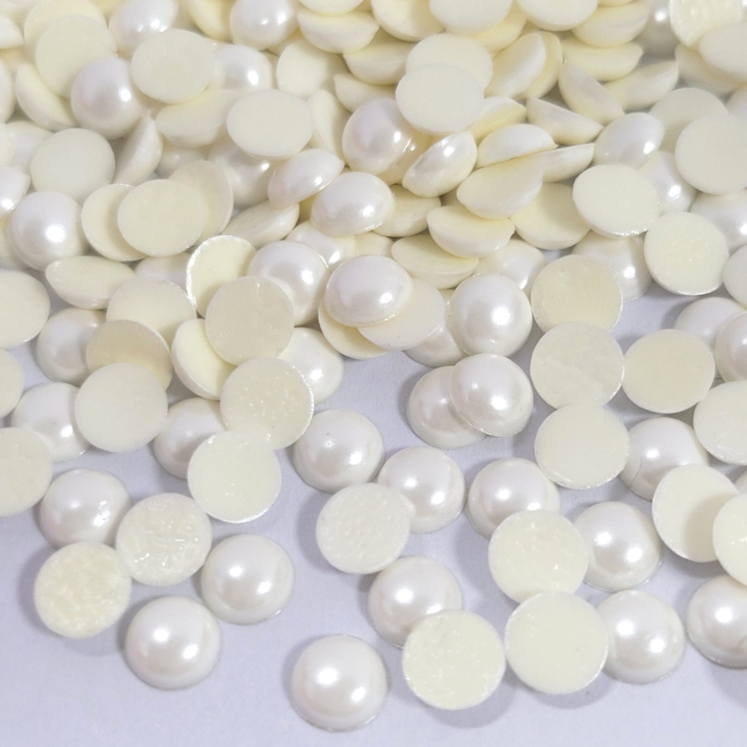 Two somewhat different black hot fix heat press pearls - Peakemb